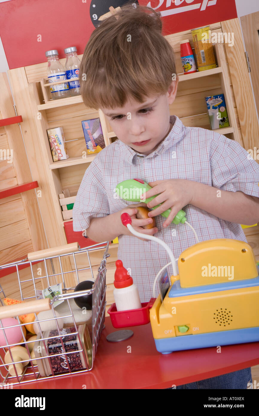 little boy playing in grocery shop for children Stock Photo - Alamy