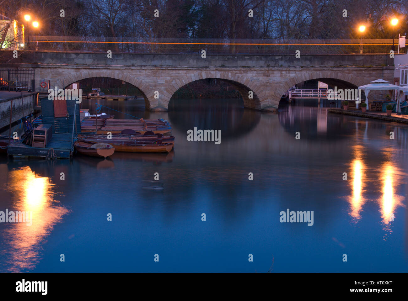 Oxford s Folly Bridge at dusk with lights reflecting on the Thames ...