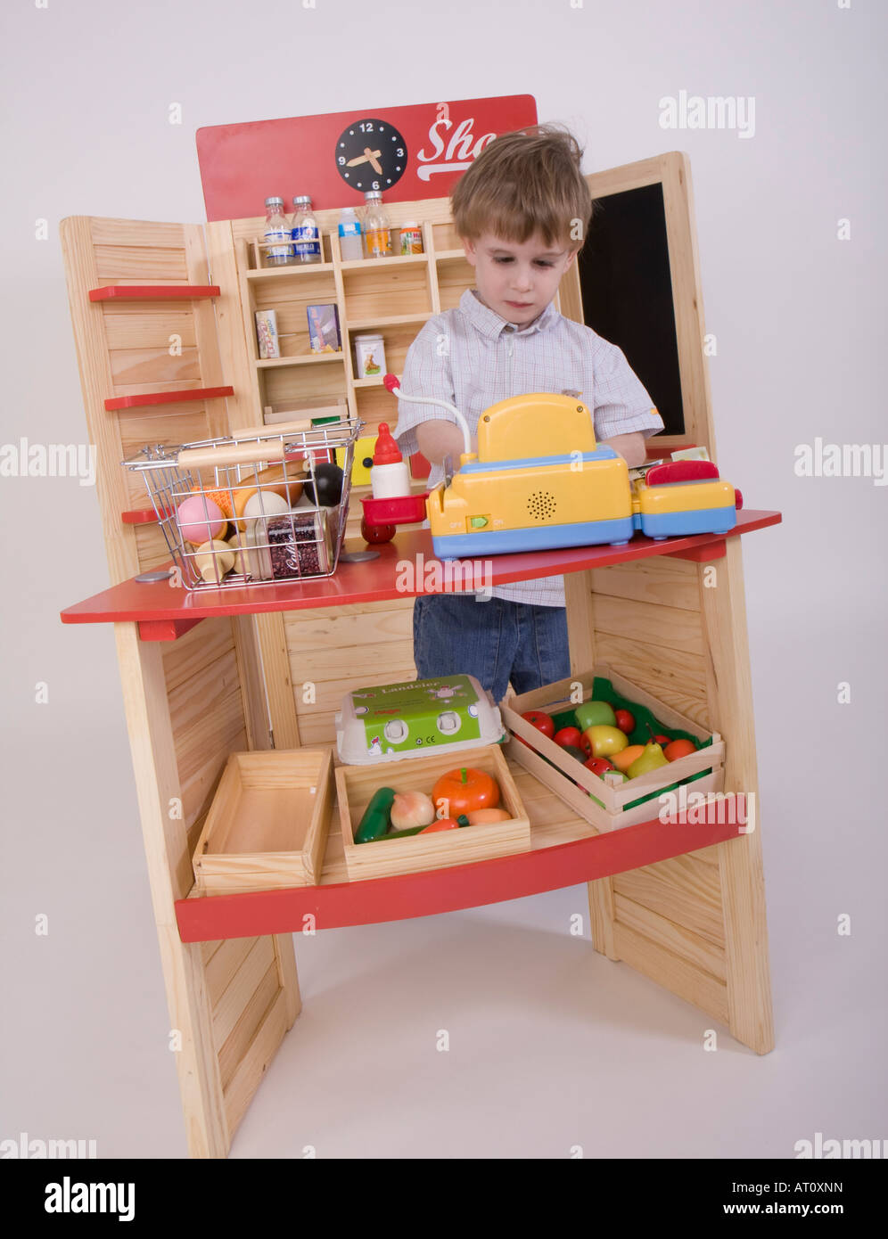 little boy playing in grocery shop for children Stock Photo - Alamy