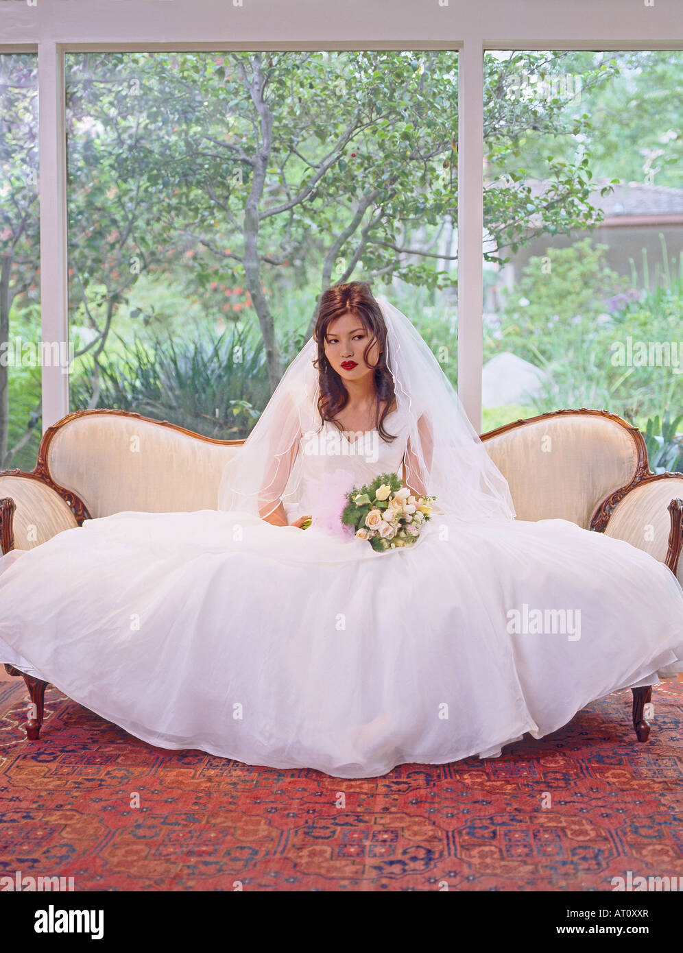 Bride in Gown Sitting on Sofa Stock Photo - Alamy
