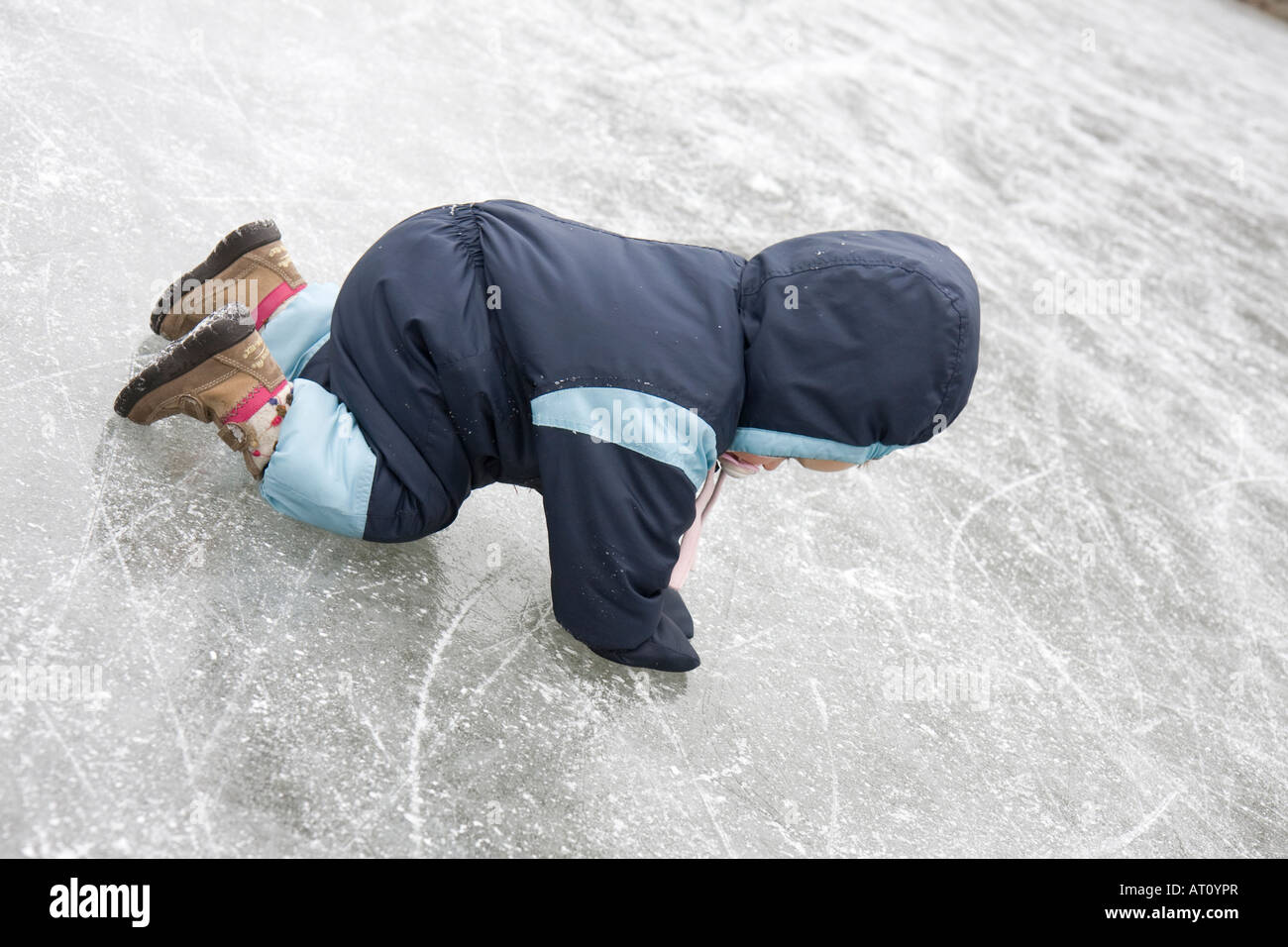 little boy lying on ice Stock Photo - Alamy