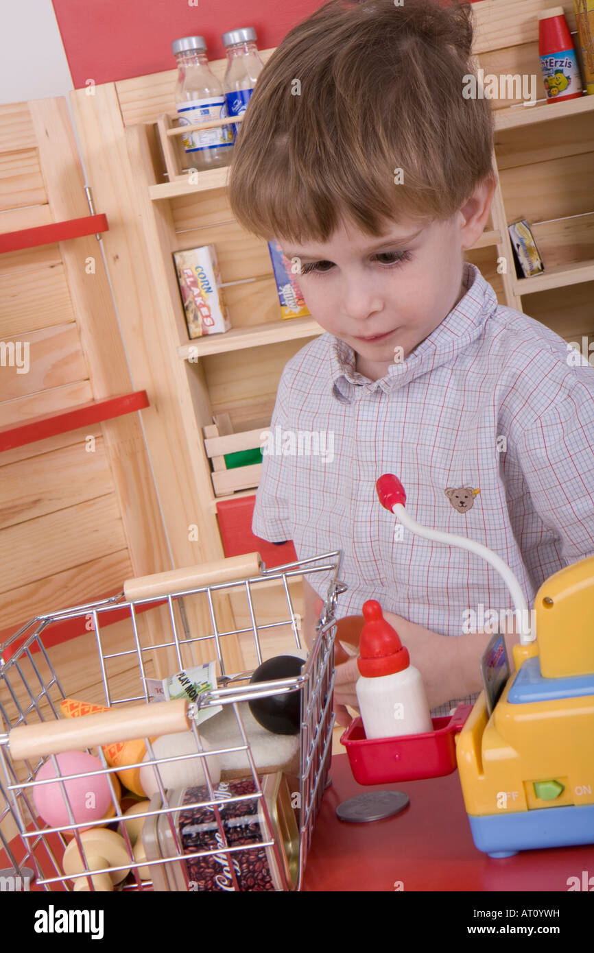 little boy playing in grocery shop for children Stock Photo - Alamy