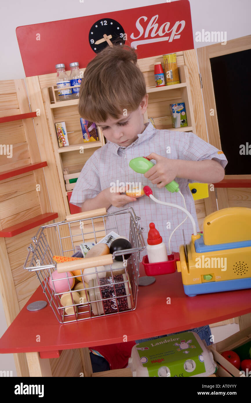little boy playing in grocery shop for children Stock Photo - Alamy