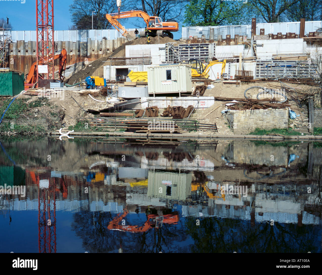 Building site seen over a river; housing development beside the River ...