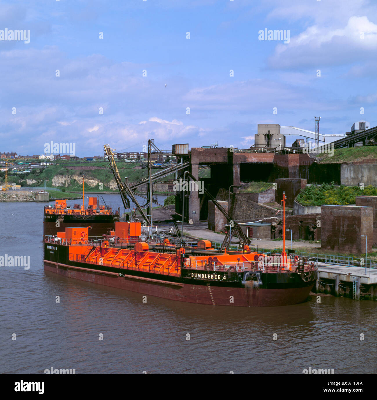 Coal barges being loaded, the first partly full and the second still ...