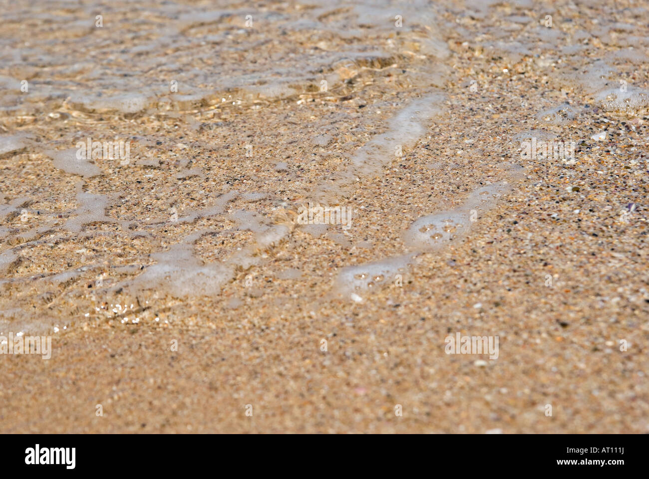 gentle water just comes over the sand Stock Photo - Alamy