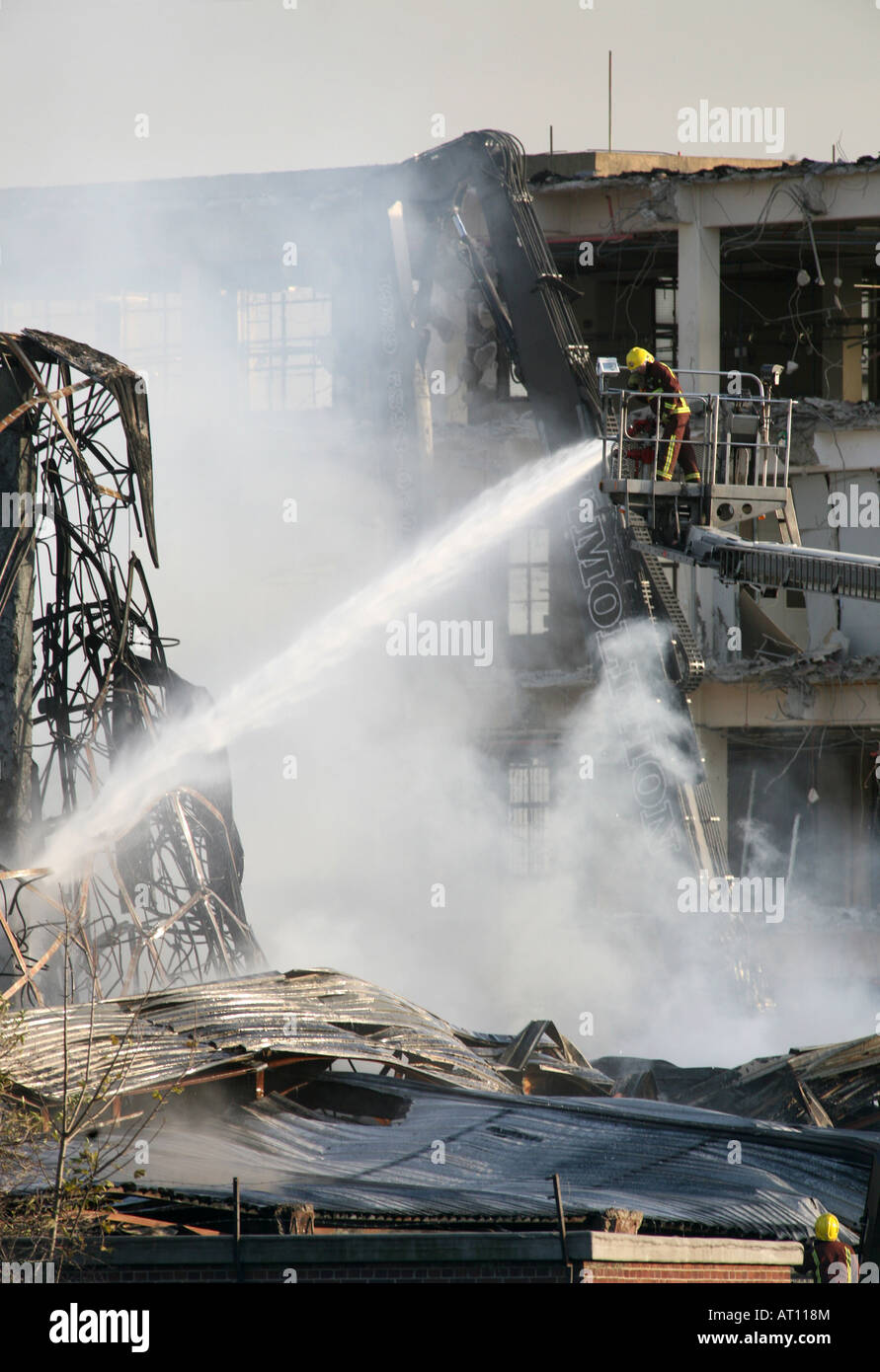 A firefighter tackiling a blaze from a high rise platform The fire was ...