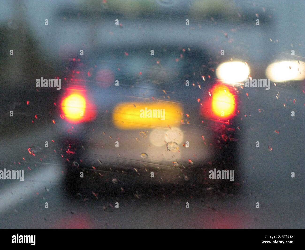 The view out of a car s windscreen of another car driving through the ...