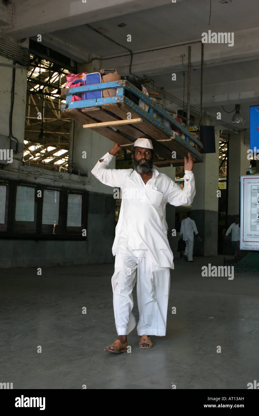 man carrying heavy load Stock Photo - Alamy