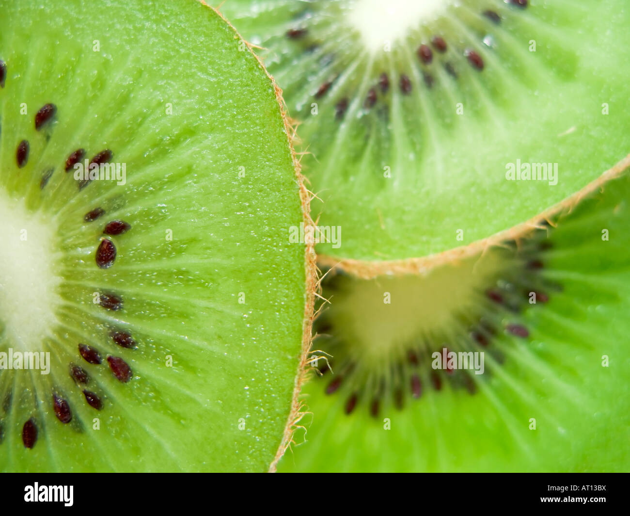 Three slices of ripe kiwis Stock Photo - Alamy