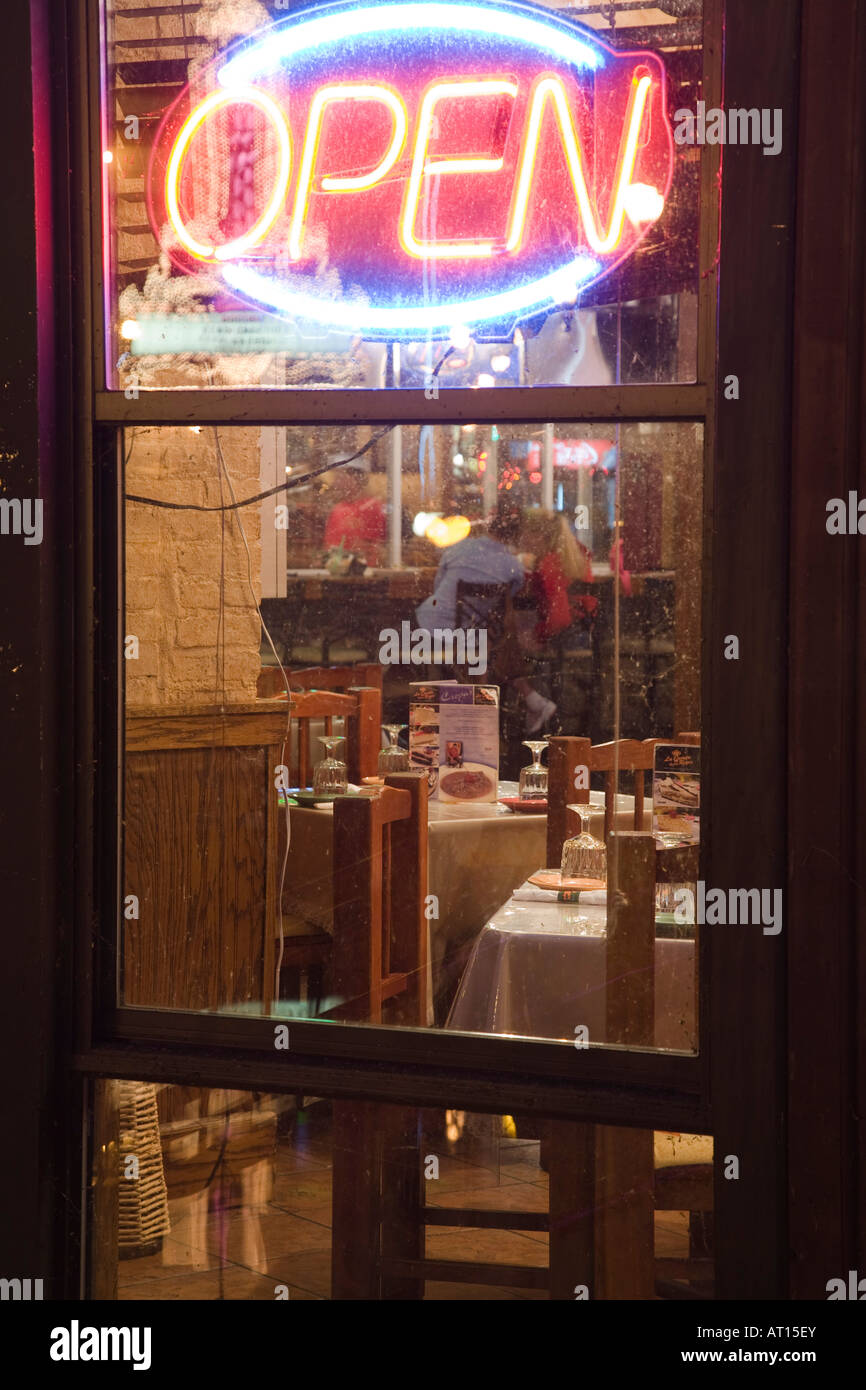 ILLINOIS Aurora Open sign in restaurant window at night view through ...