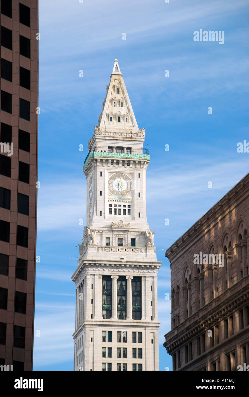 clock tower surrounded by building Stock Photo - Alamy
