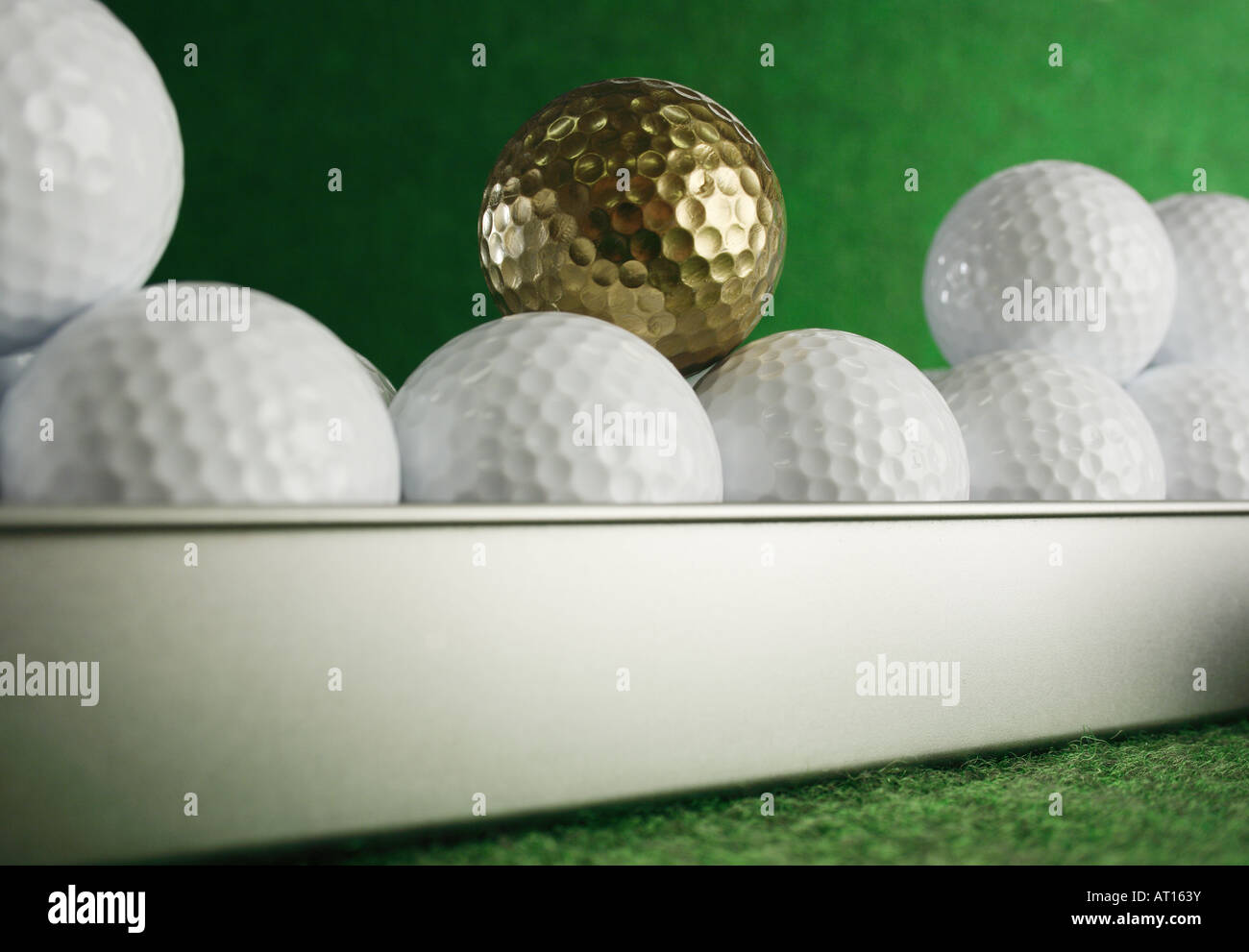 Golden golfball for the really great shots Stock Photo - Alamy