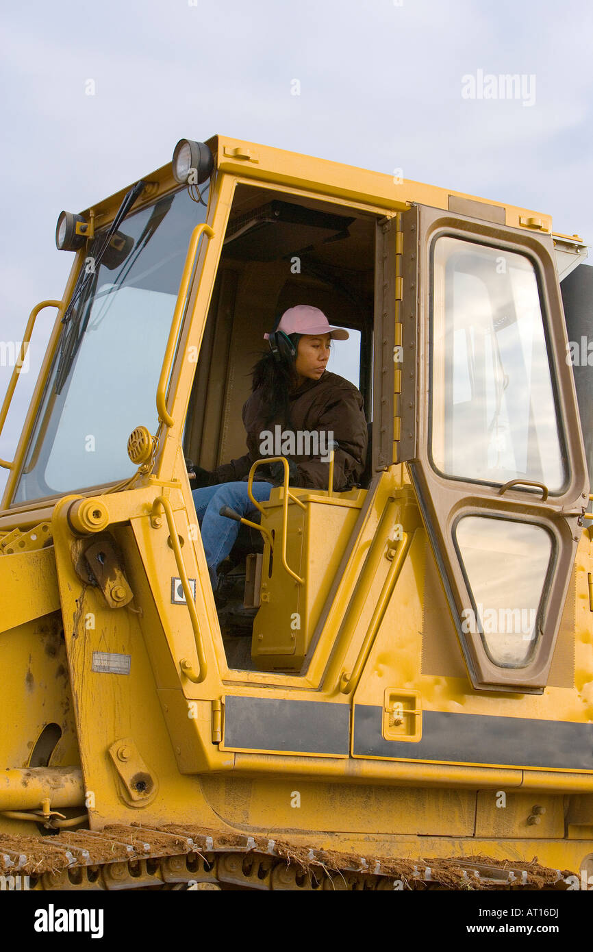Woman operating bulldozer at a construction site Stock Photo - Alamy