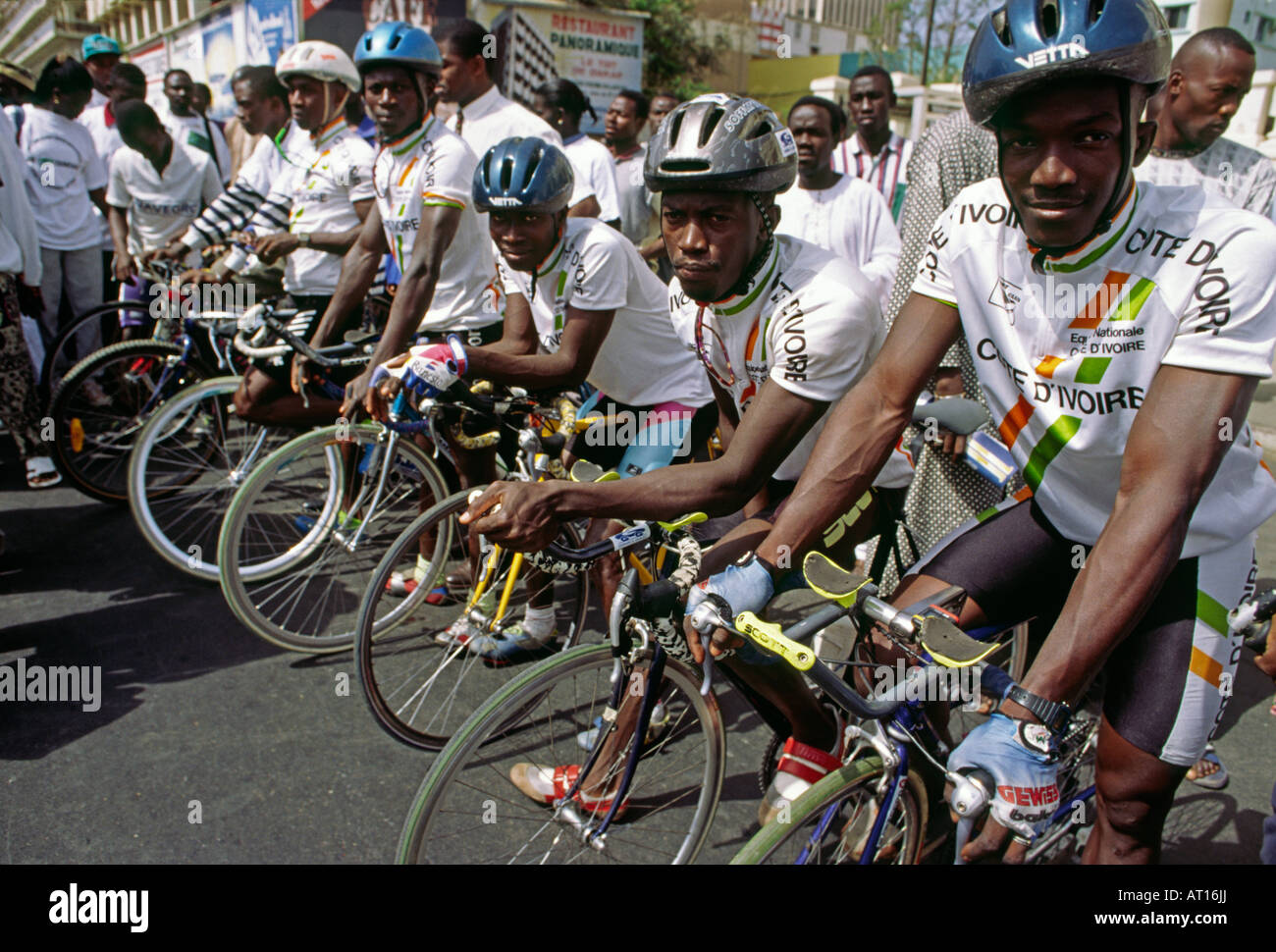 Bicycle racers from Cote D'Ivoire line up at the start of a race in ...