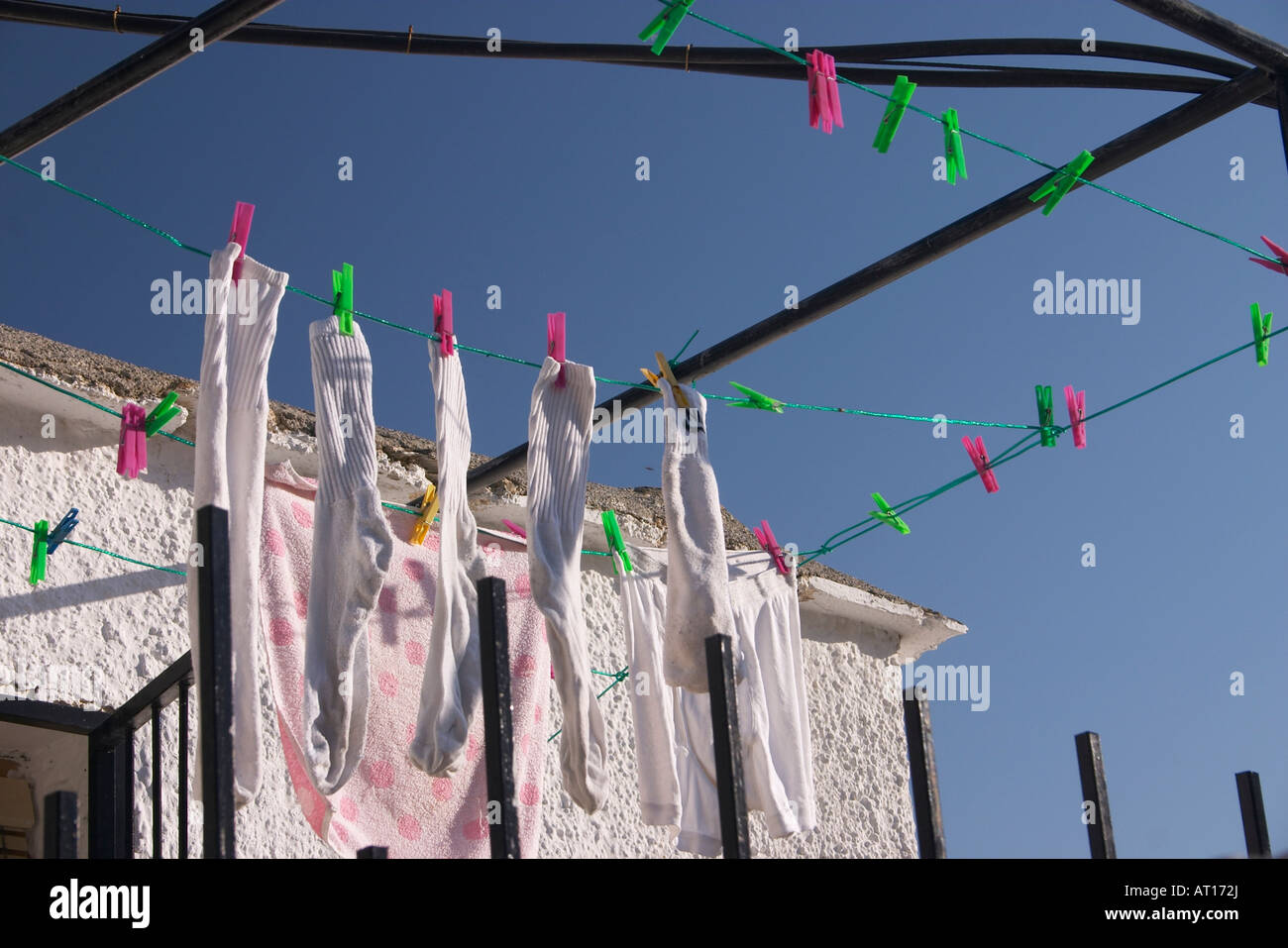 Socks on clothesline Stock Photo - Alamy