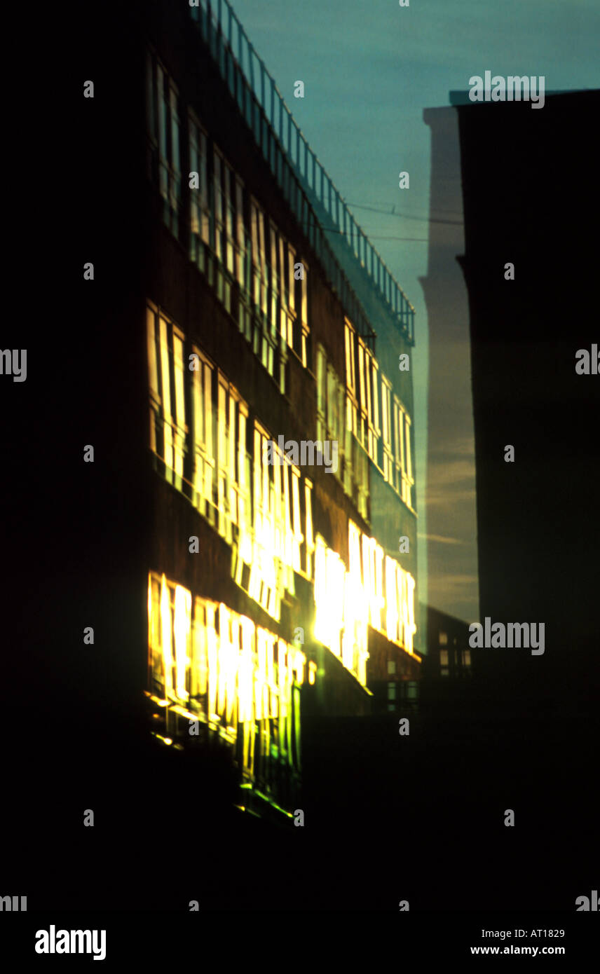 Office blocks reflected in window Stock Photo - Alamy