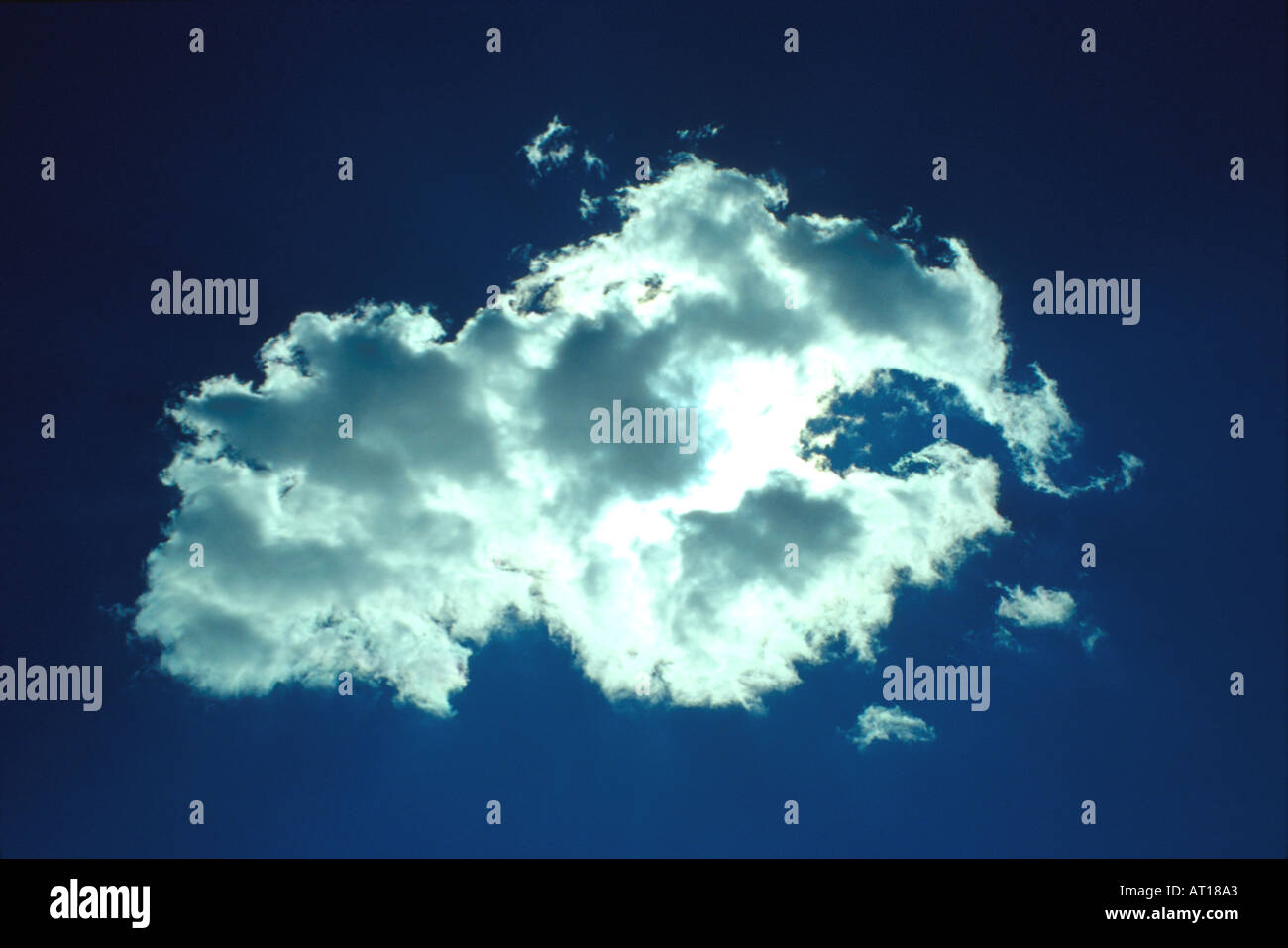 backlit single cloud in sky Stock Photo - Alamy