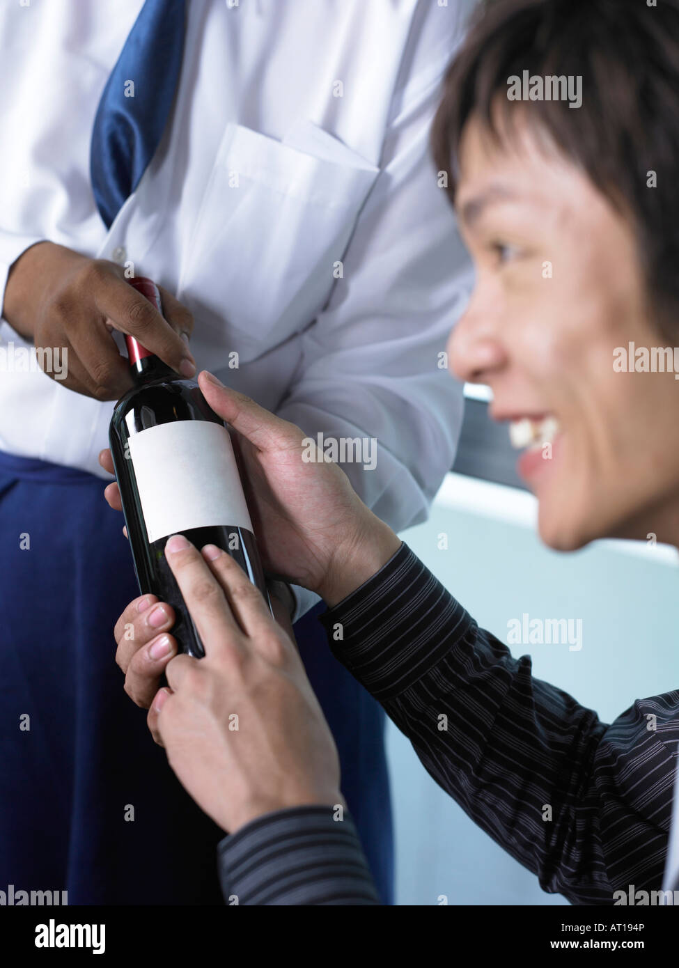 Waiter showing people to table hi-res stock photography and images - Alamy