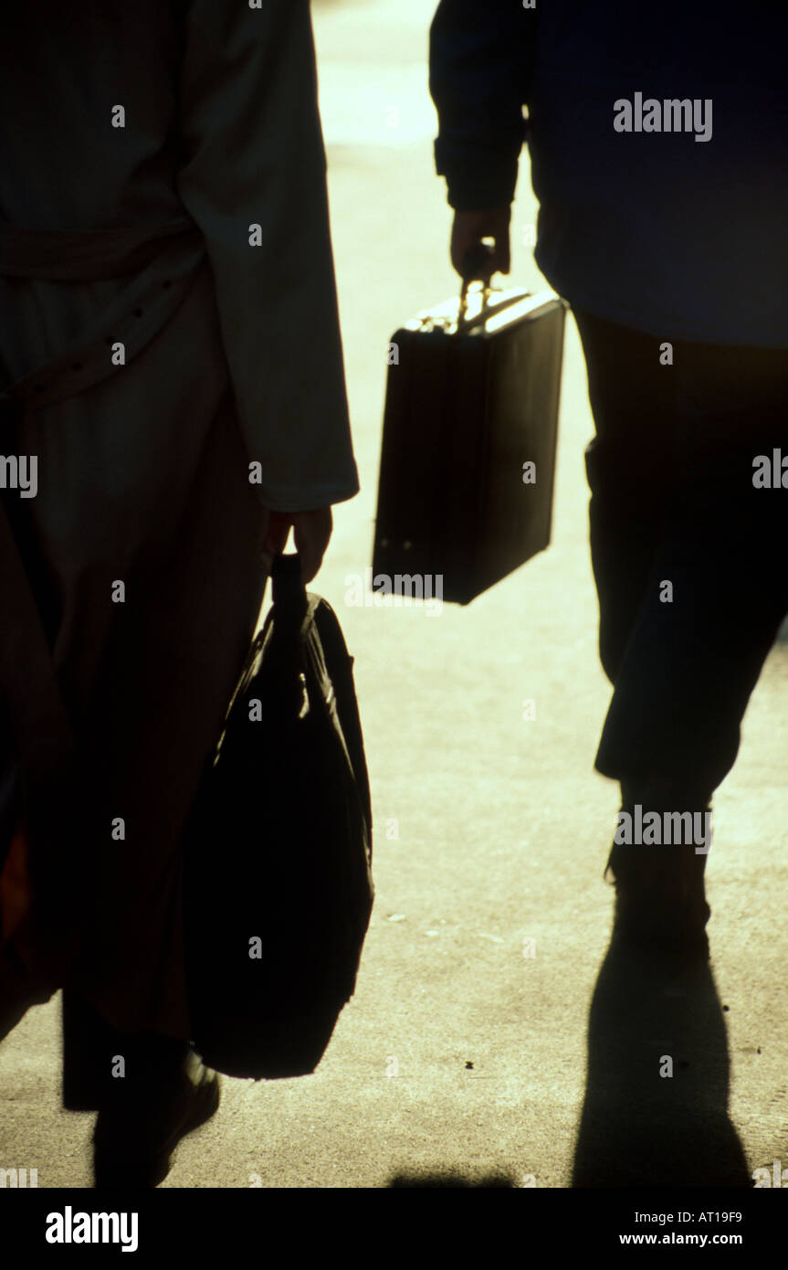 man walking with briefcase in silhouette Stock Photo - Alamy