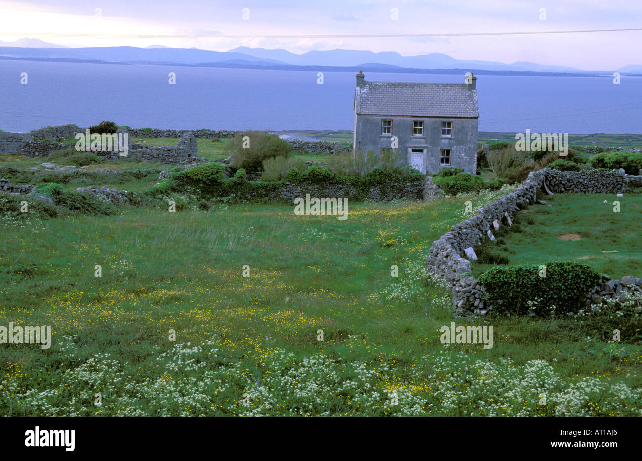 Ireland, Inishmore, Aran island, Stone house and wall Stock Photo - Alamy