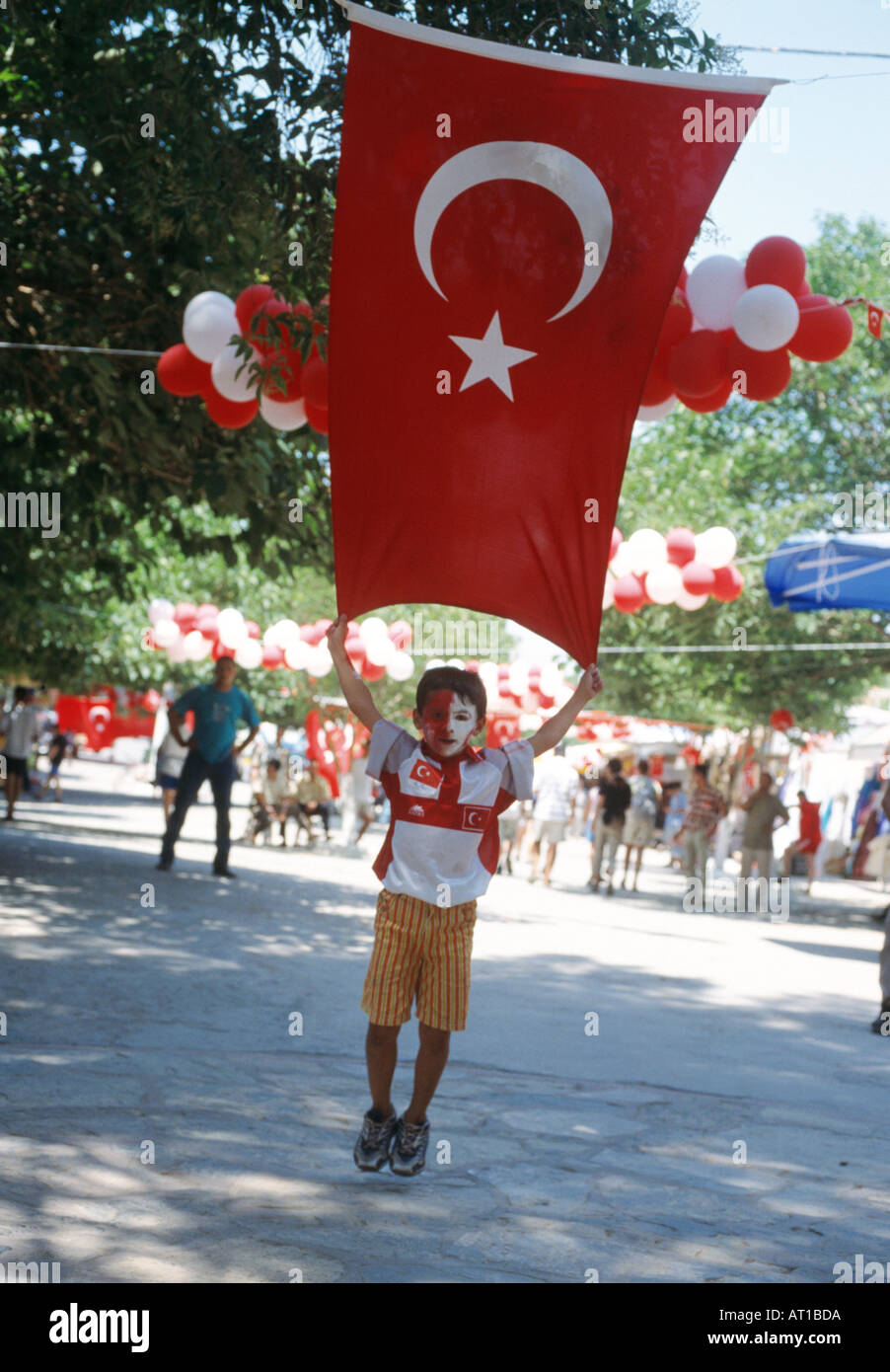 Turkish boy holding Turkish flag and jumping and celebrating Stock ...