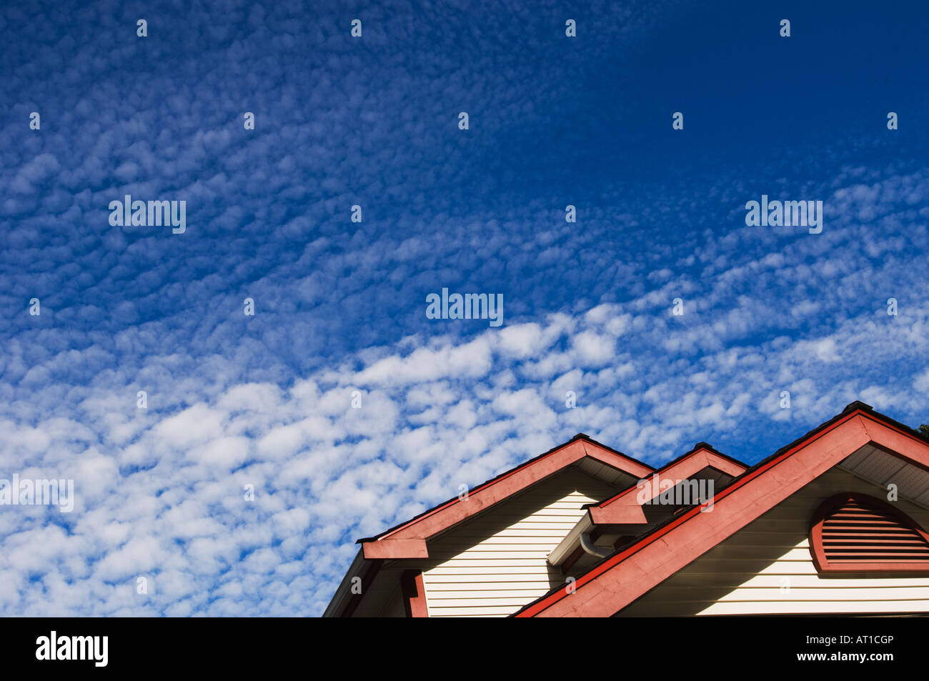 Corner of the roof of a beautiful house against a blue sky with soft ...