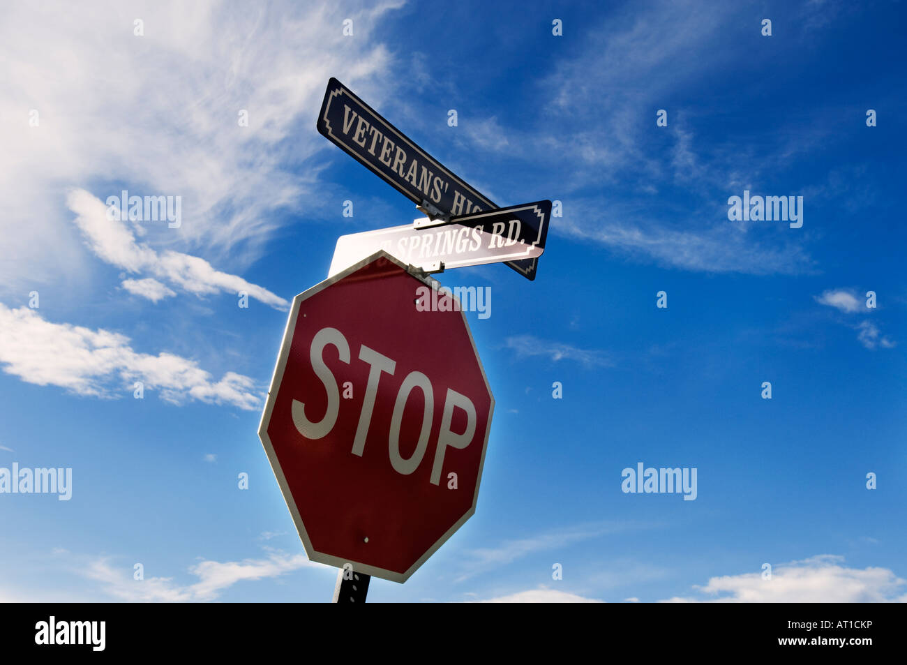 Red stop road sign against blue sky background with soft white clouds ...