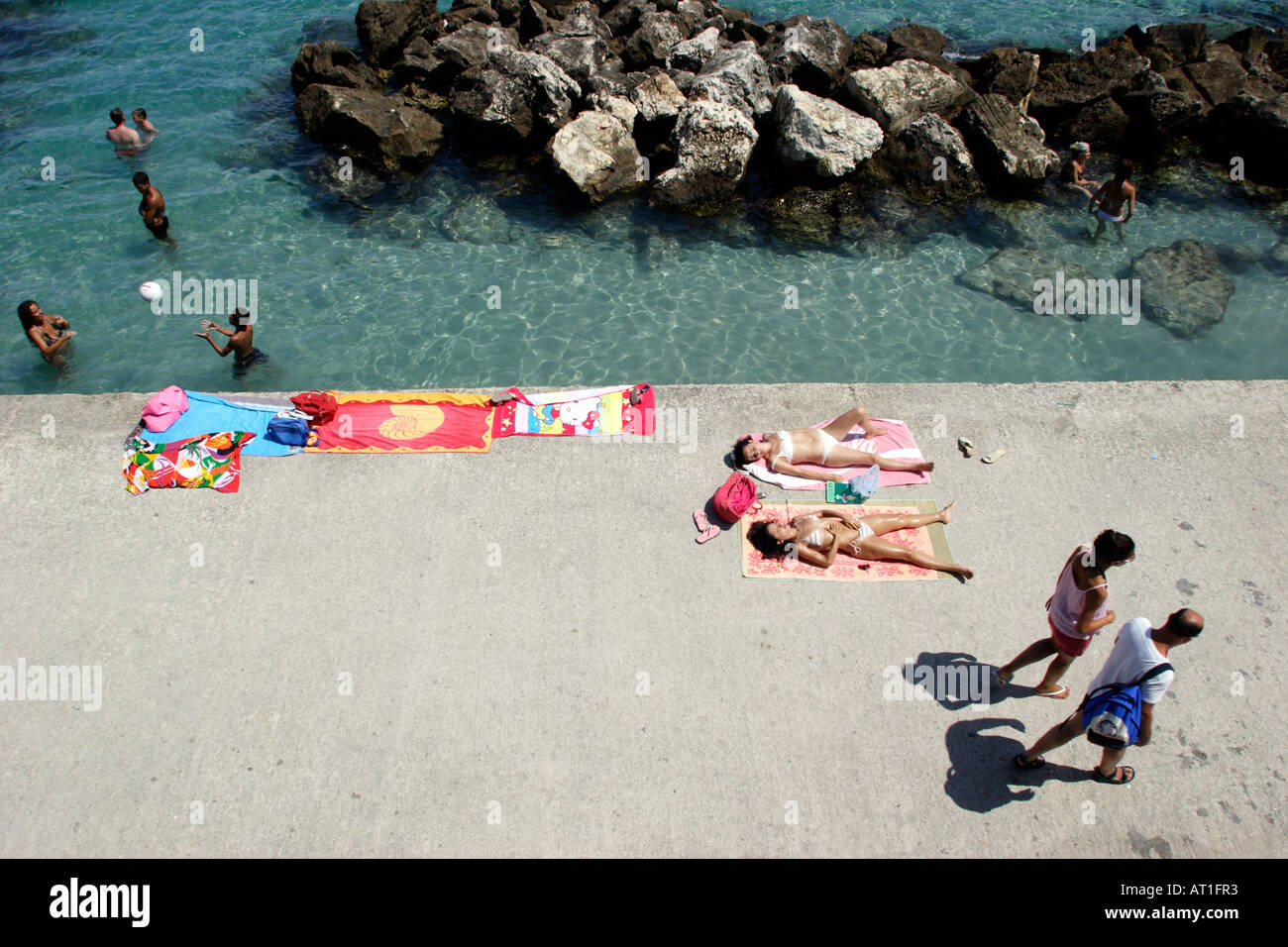 Sunbathers on the wharf hi-res stock photography and images - Alamy