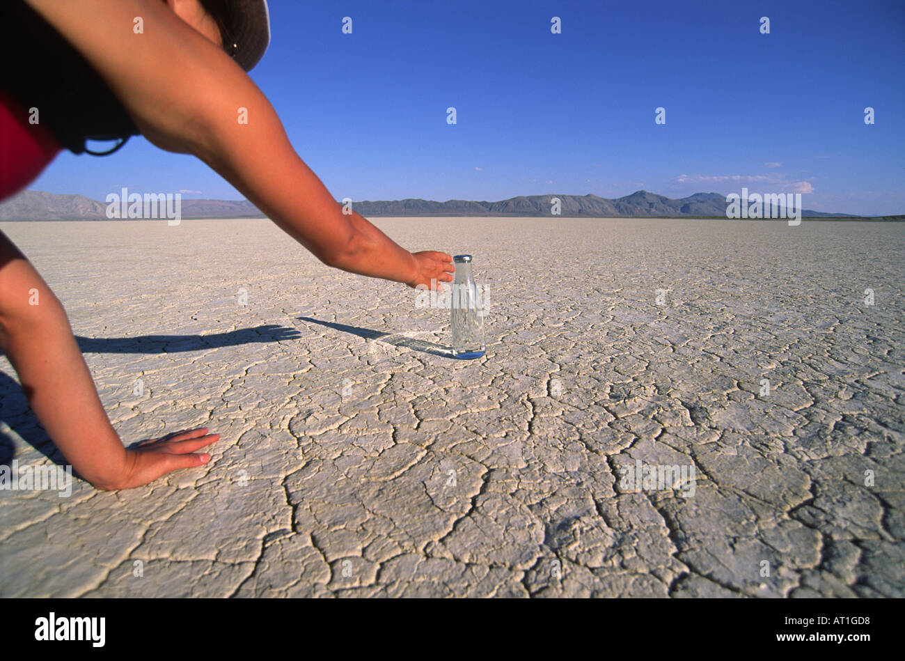 Woman desperately reaching for a bottle of water on the Black Rock ...