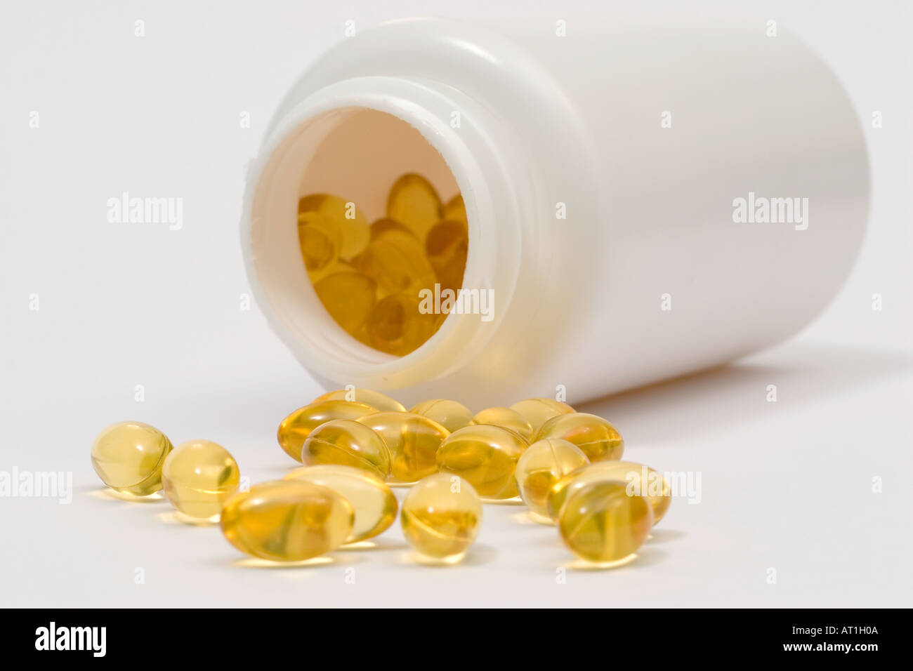 cod liver oil tablets golden many Stock Photo - Alamy
