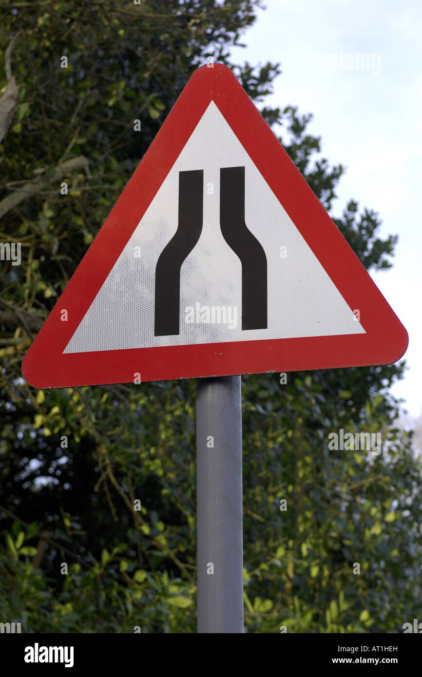 English road sign triangle warning that the road narrows ahead Stock ...