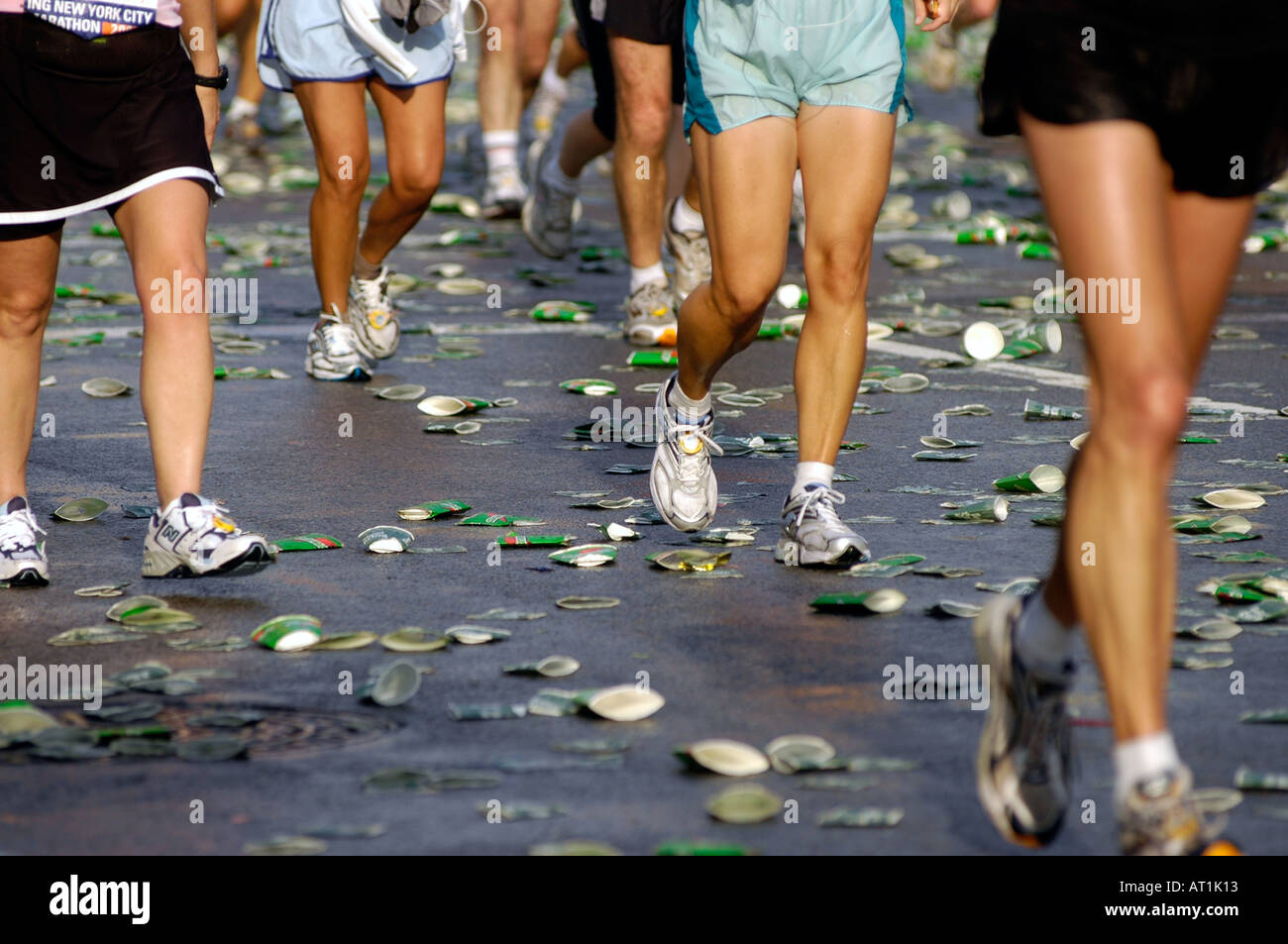 Runners race through Harlem at the 22 mile mark in the New York City ...