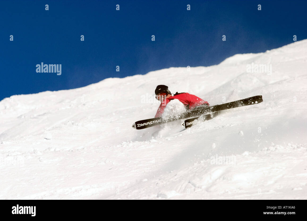 Male skier taking a dramatic tumble down a steep slope Stock Photo - Alamy