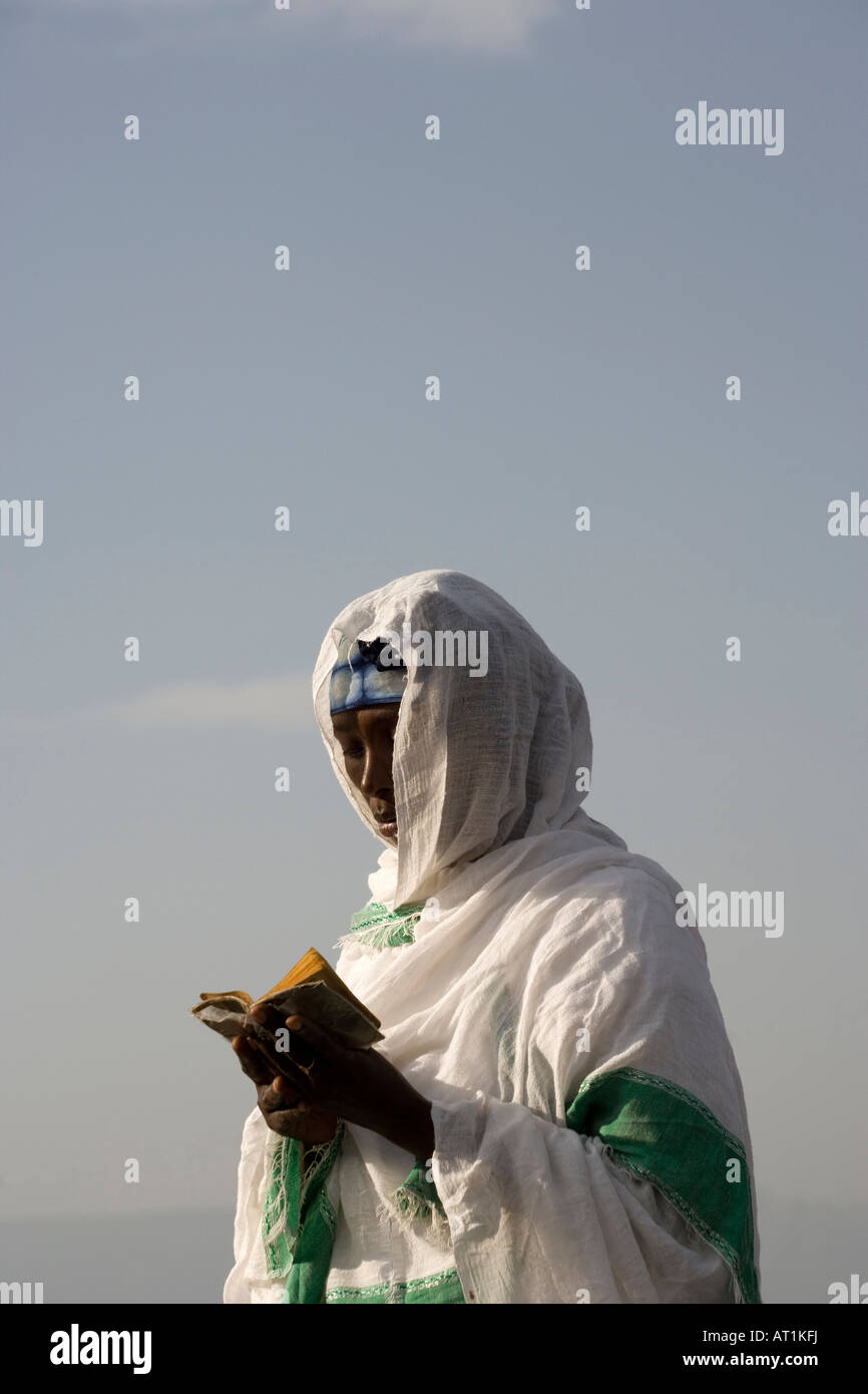 Coptic Christian Woman in Worshipper's White Robe at Prayer in Lalibela ...