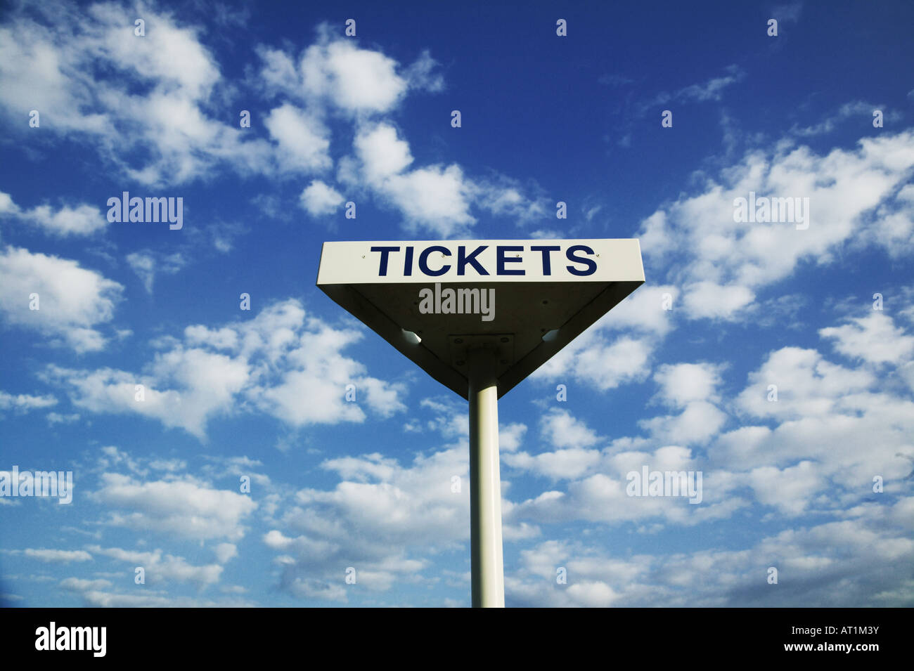 A tickets sign pictured under blue skies Stock Photo - Alamy
