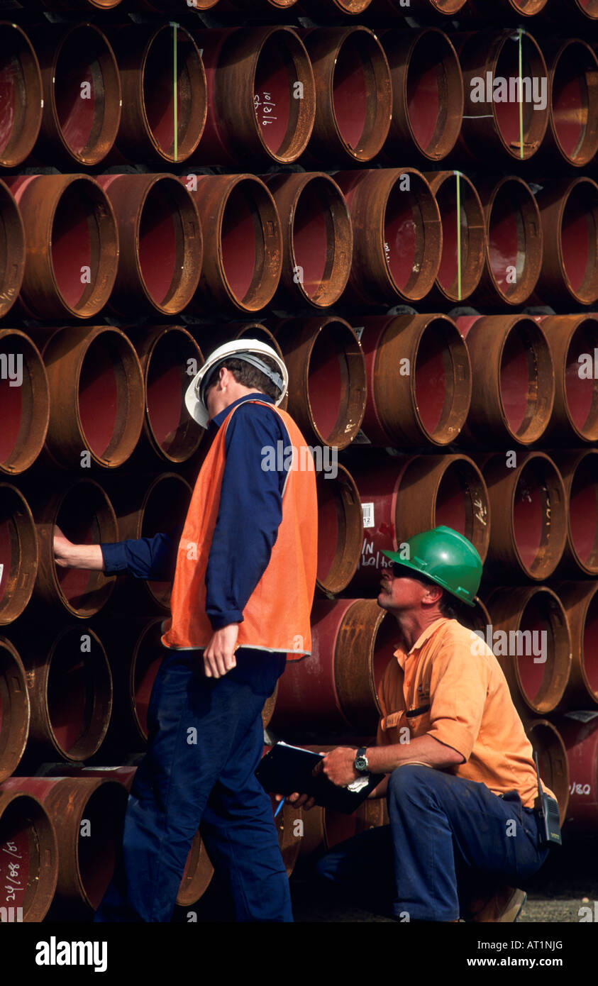 Workers checking [natural gas] pipes Stock Photo - Alamy