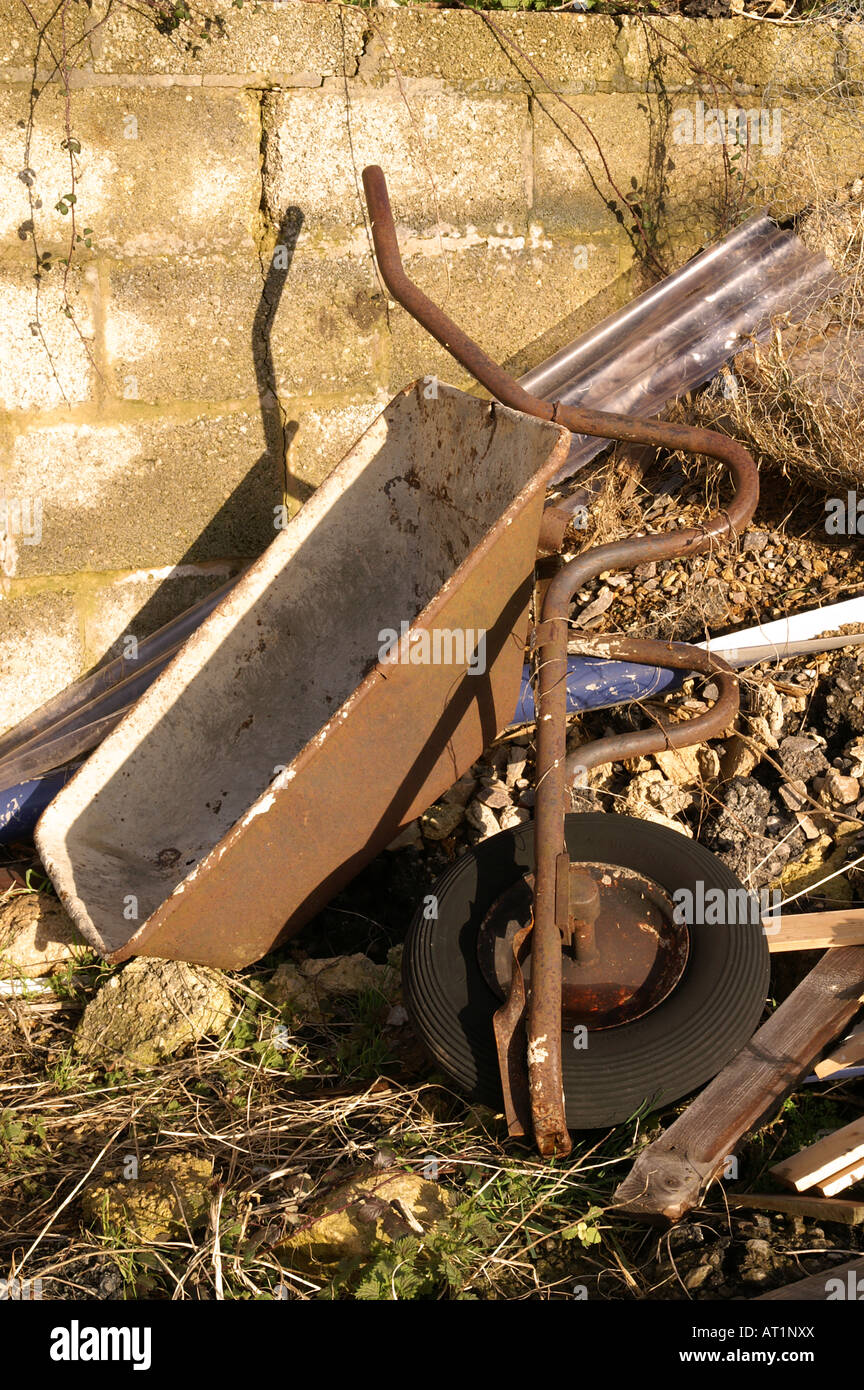 Broken wheelbarrow hi-res stock photography and images - Alamy