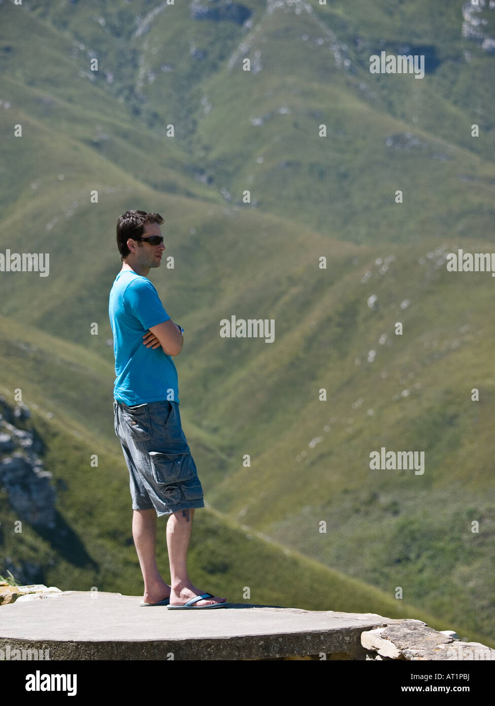 Young Man looking out over a valley in Tsitsikamma mountains Stock ...