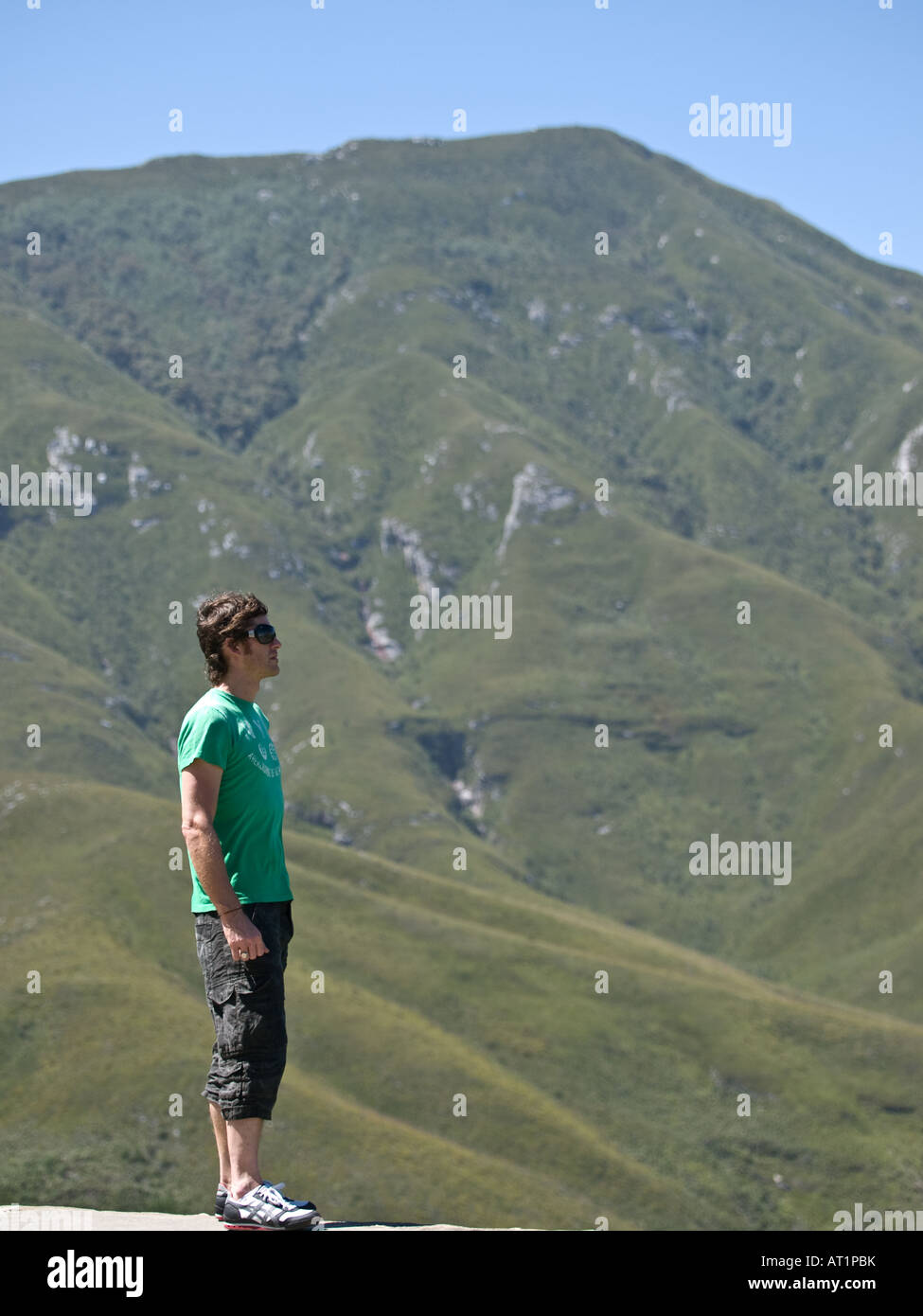 Young Man looking out over a valley in Tsitsikamma mountains Stock ...