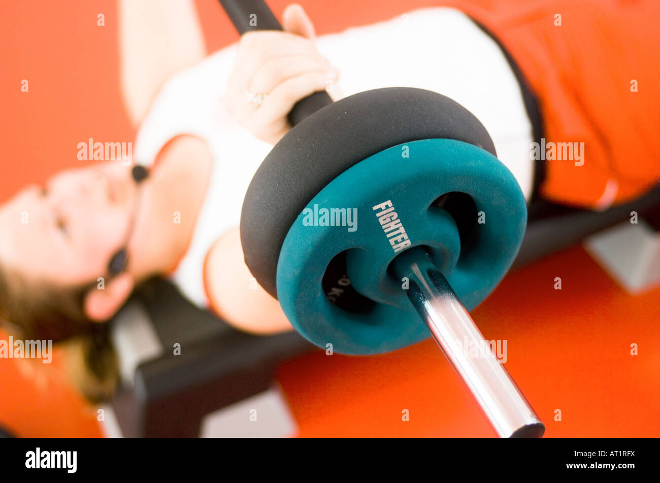 Female aerobics trainer showing bodytoning with light weights Stock ...