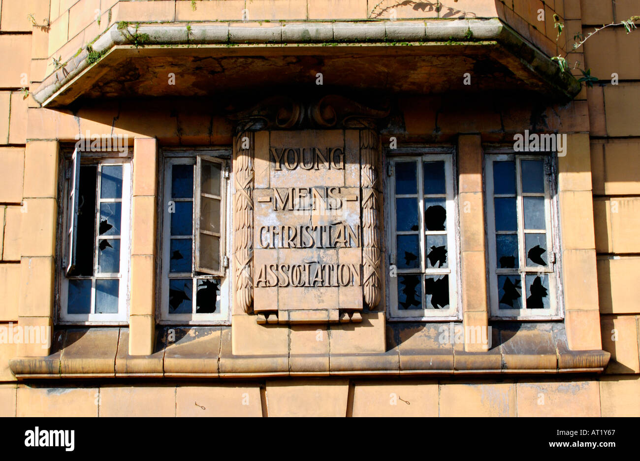 Derelict and boarded up Young Mens Christian Association YMCA building ...
