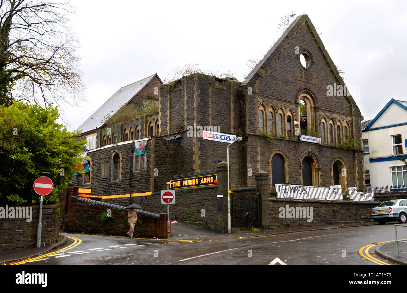 Derelict former Miners Hall dated 1921 at Merthyr Tydfil in the South ...