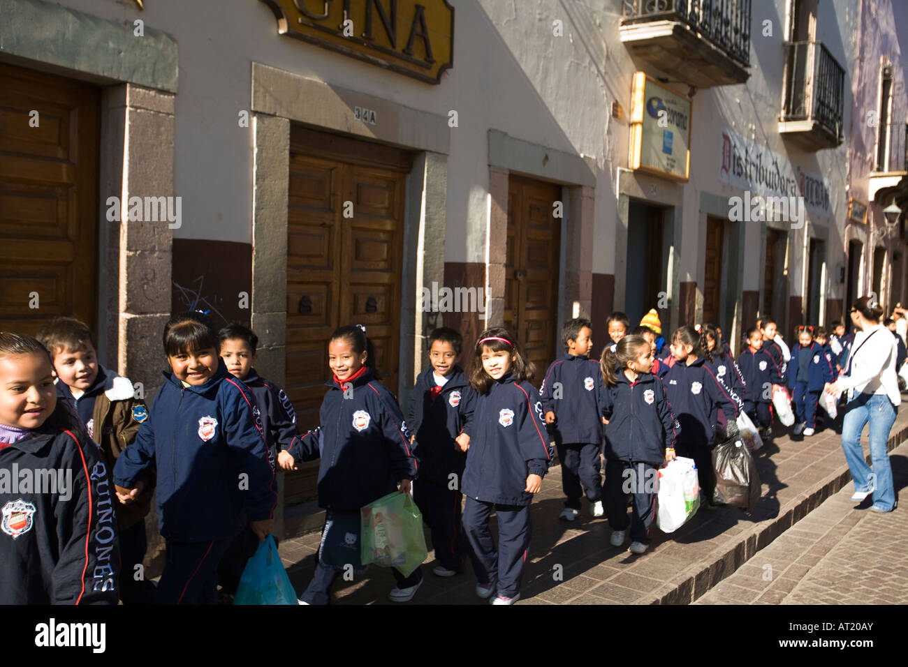 MEXICO Guanajuato Large group of young students in school uniforms ...