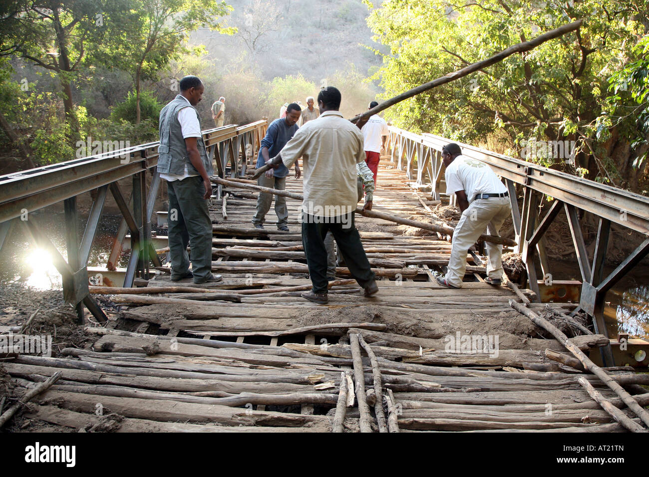 Fixing a bridge with logs in Ethiopia, Africa Stock Photo - Alamy
