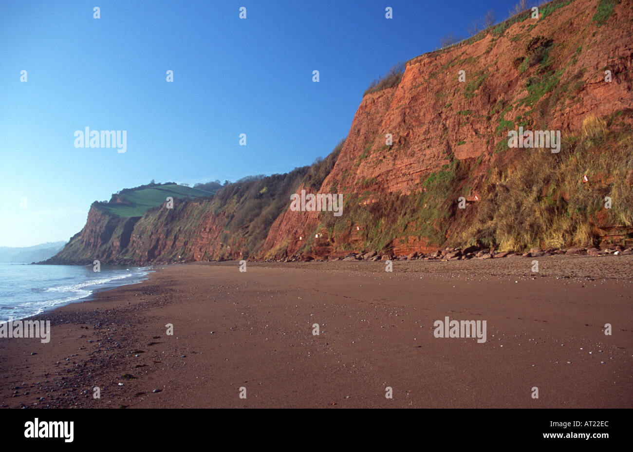 A red sandy beach cliff at the Ness Shaldon Devon Great Britain Stock ...