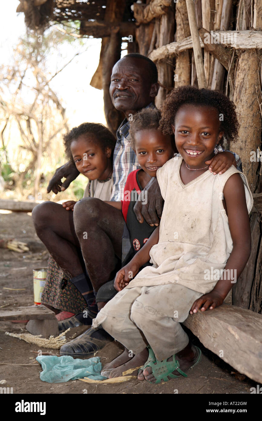 African family in front of hut Stock Photo - Alamy