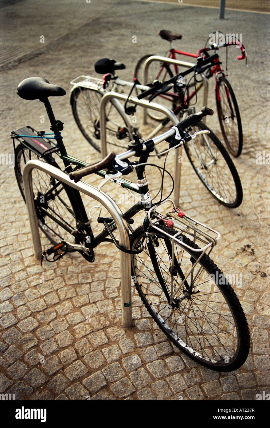 bikes parked in bike stops Stock Photo - Alamy