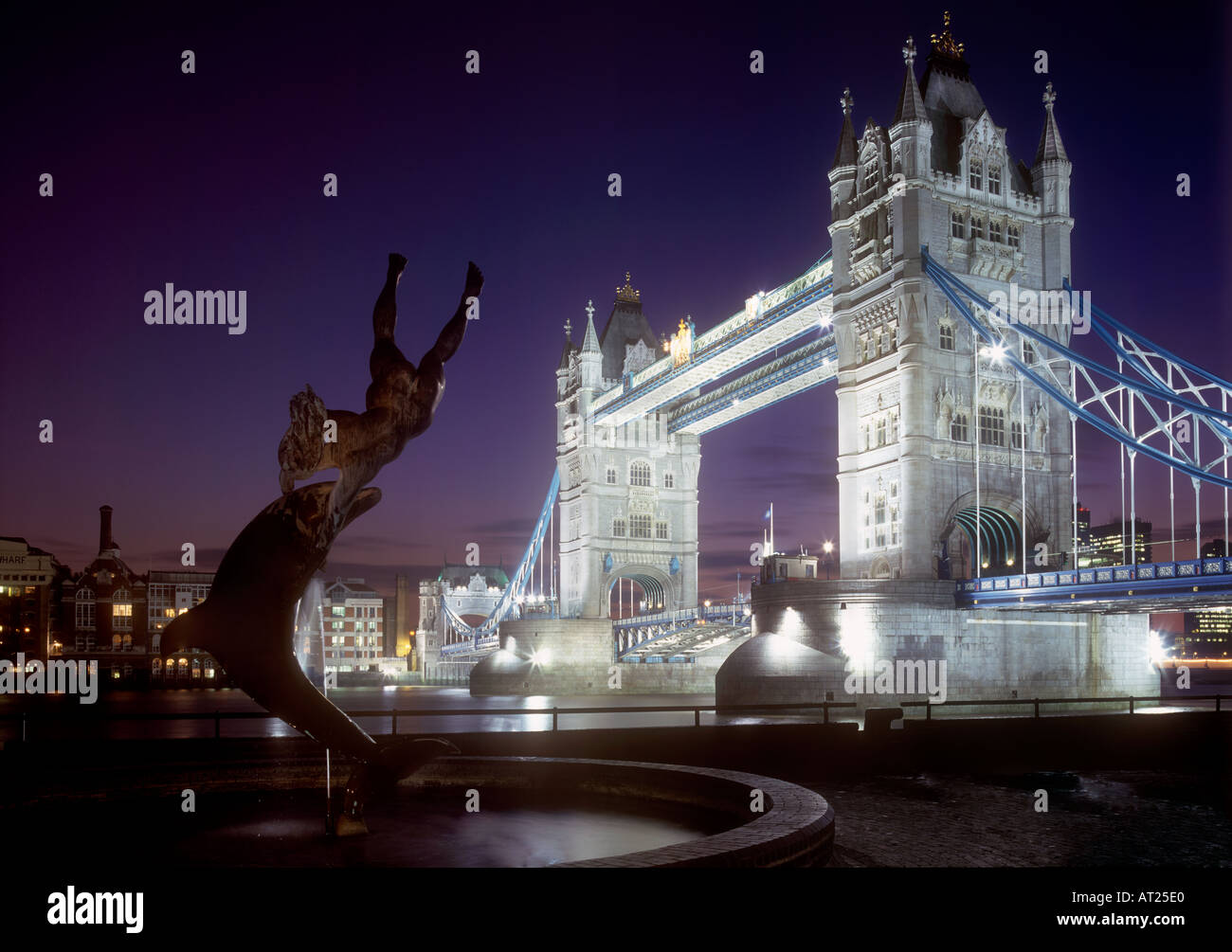 Girl and Dolphin Tower Bridge lit up at night London UK Stock Photo - Alamy