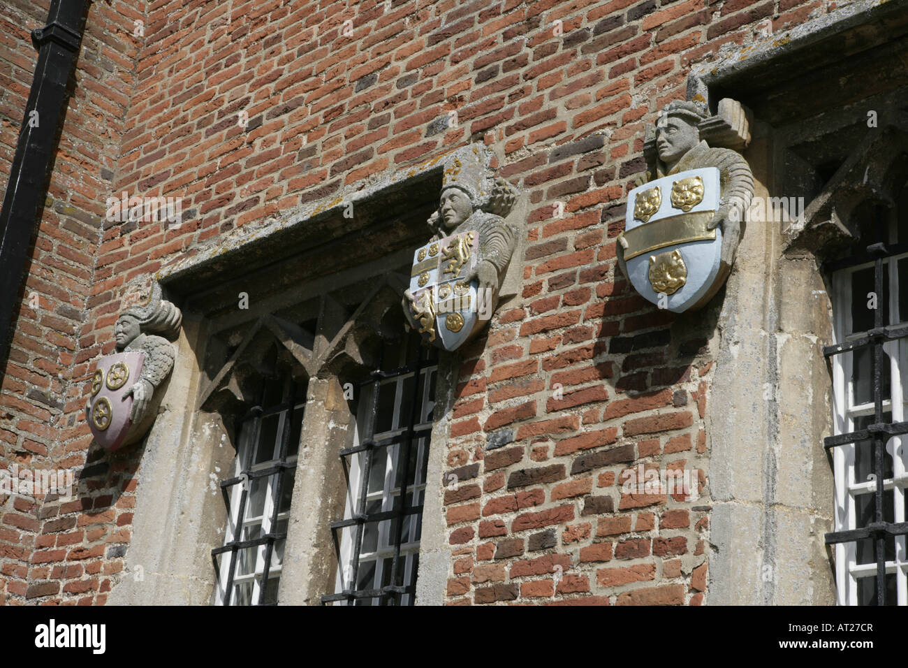 The school in the Oxfordshire village of Ewelme with figures bearing ...